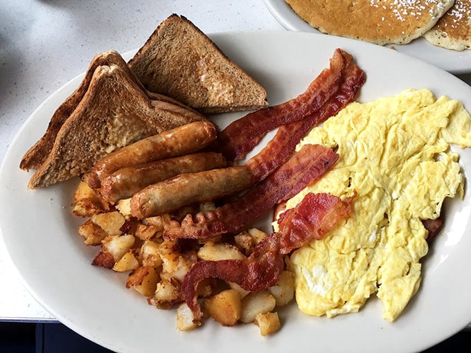 The classic American breakfast trifecta&mdash;eggs, meat, and toast&mdash;executed with the precision of a breakfast symphony conductor.