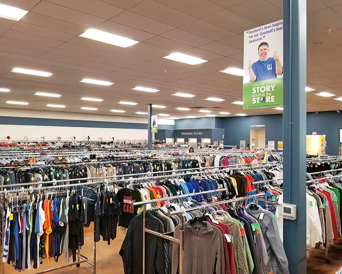 A rainbow of possibilities hangs in perfect formation. Each garment whispers, "Take me home," while your wallet sighs with relief at the price tags.