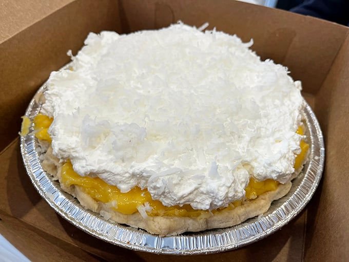 Coconut cream pie that rises like a sugary Everest, with enough whipped topping to make you wonder if clouds taste this good.