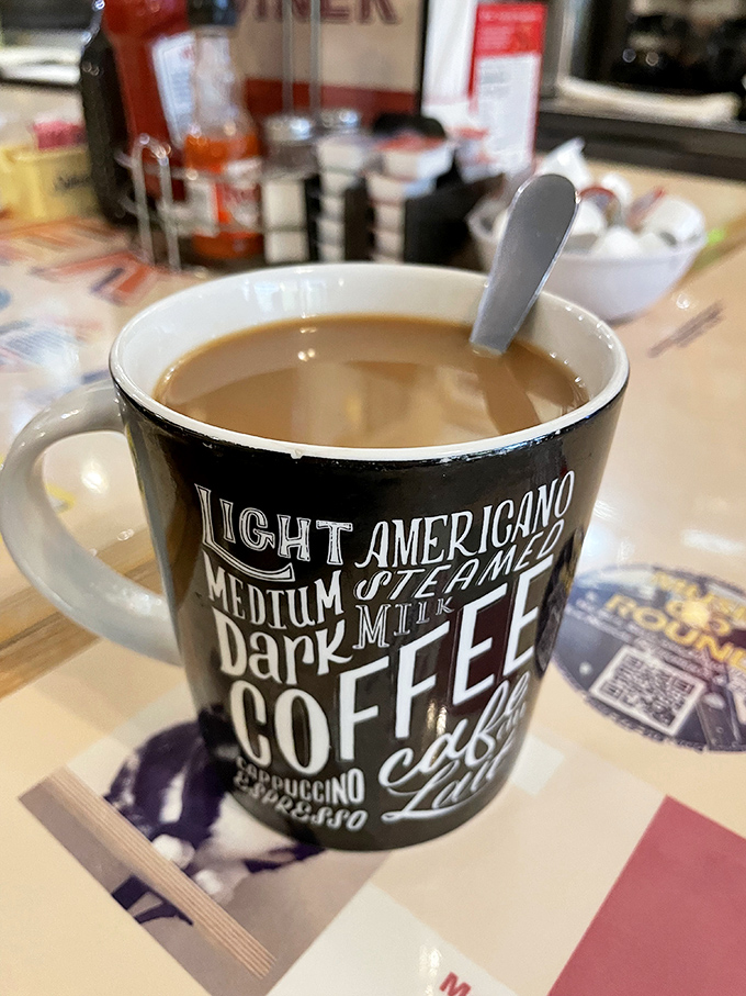 Coffee served in a mug that tells you exactly what you're getting &ndash; no pretentious pour-overs or fancy foam art here, just honest caffeine in ceramic form.
