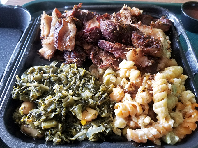 This isn't just a meal; it's a flavor symphony where greens, mac and cheese, and perfectly seasoned meat perform in perfect harmony.