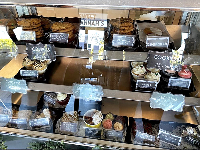 The display case – a glass-fronted museum of edible art where cookies and cupcakes compete for your affection.