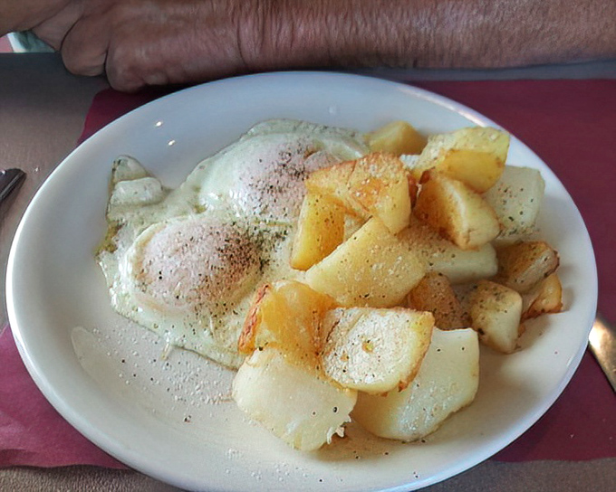 Sunny-side up eggs with home fries&mdash;the breakfast equivalent of a perfect day where nothing goes wrong and everything tastes right.