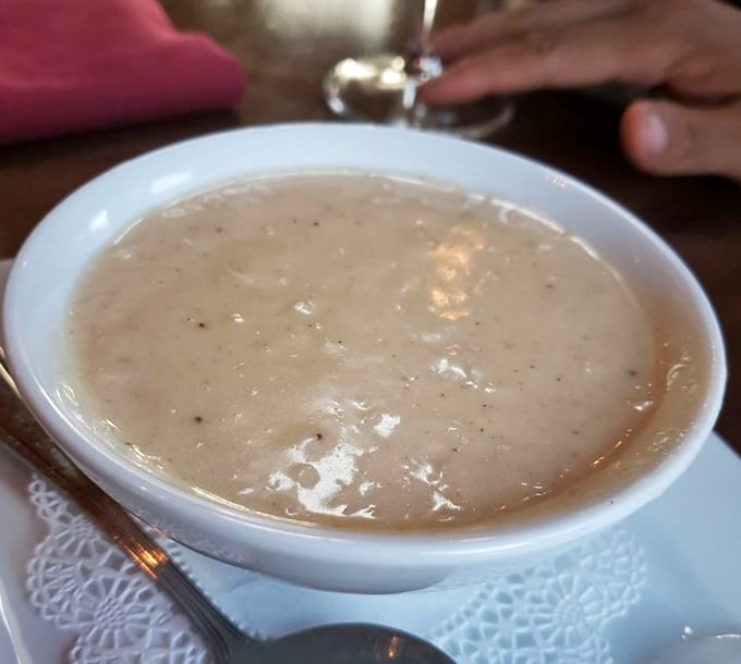 A bowl of crab bisque that whispers seafood secrets &ndash; creamy, rich, and worth every calorie-laden spoonful.