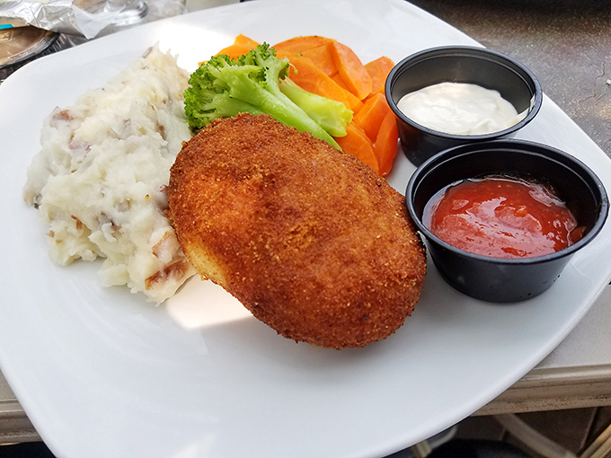 The legendary crab cake&mdash;more crab than cake, as it should be&mdash;served with sides that know their supporting role and play it perfectly.