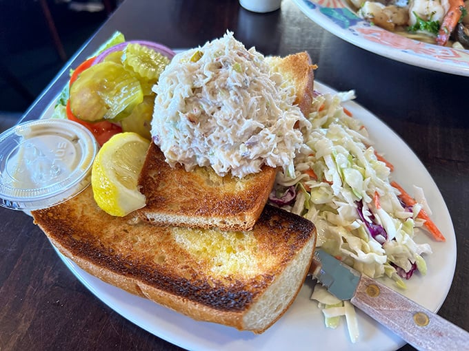 The crab sandwich that launched a thousand road trips—simple, generous, and requiring multiple napkins and absolutely zero regrets.