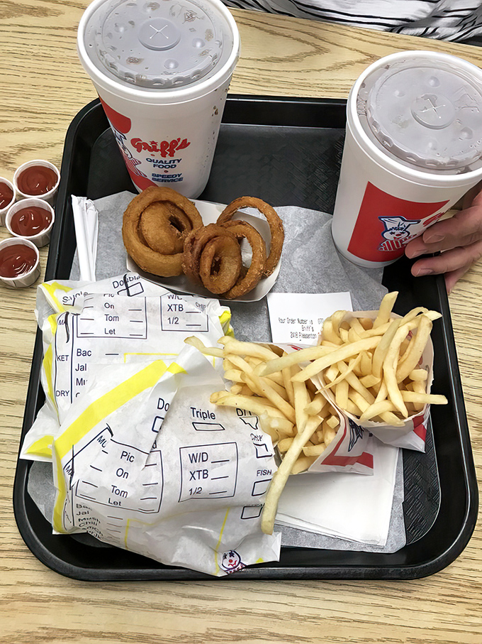 Onion rings that deserve their own fan club, fries that never disappoint, and drinks large enough to survive a Texas summer.