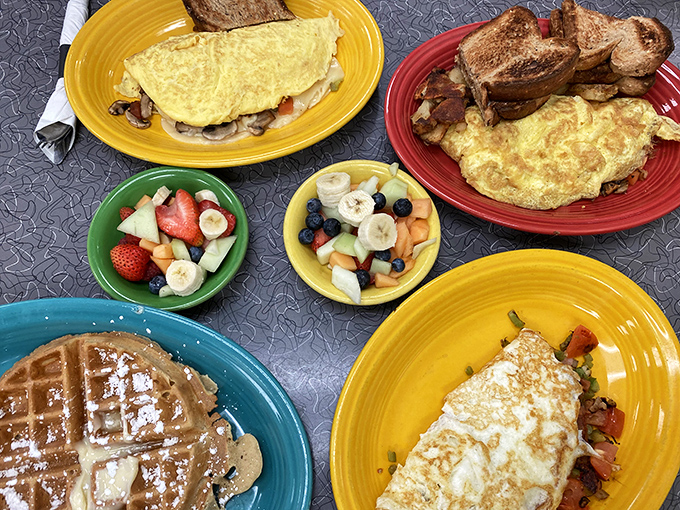 A breakfast spread that would make Ron Swanson weep with joy – omelets, fruit, waffles, and enough options to require multiple visits.