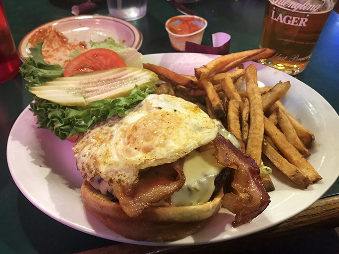 Breakfast meets burger in this masterpiece topped with a perfectly fried egg and bacon. The hangover cure you didn't know you needed.