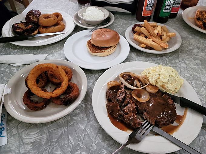 A table spread that says "bring your appetite and leave your diet at the door." That hamburger steak swimming in gravy is calling your name.