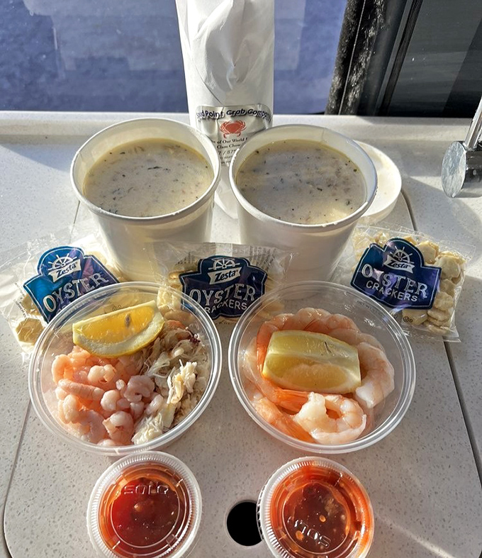 Two cups of liquid gold flanked by seafood cocktails and crackers. The kind of spread that makes you want to send a smug photo to friends stuck at desk jobs.
