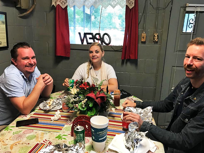 Happy diners gathered around the table, their faces showing that universal expression that says, "I've found something authentic in a world of pretenders."