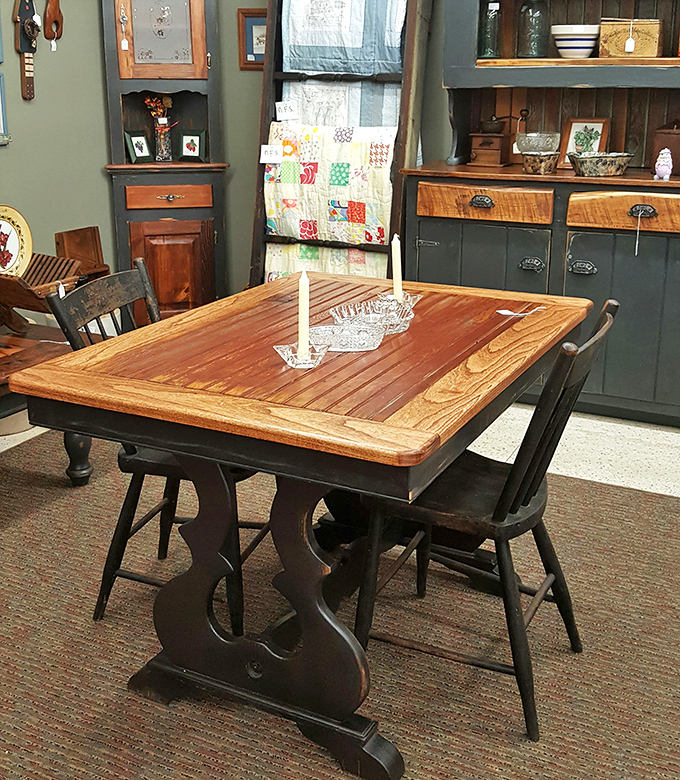 A farmhouse table that's actually seen a farm, paired with chairs that have supported generations of family stories.