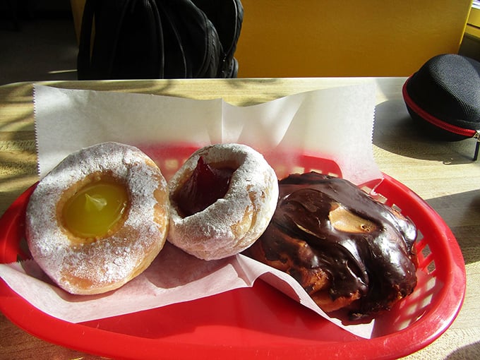 These red baskets cradle their precious cargo like Olympic medals. The powdered jelly-filled looks like it's wearing a winter coat of sugary snow.