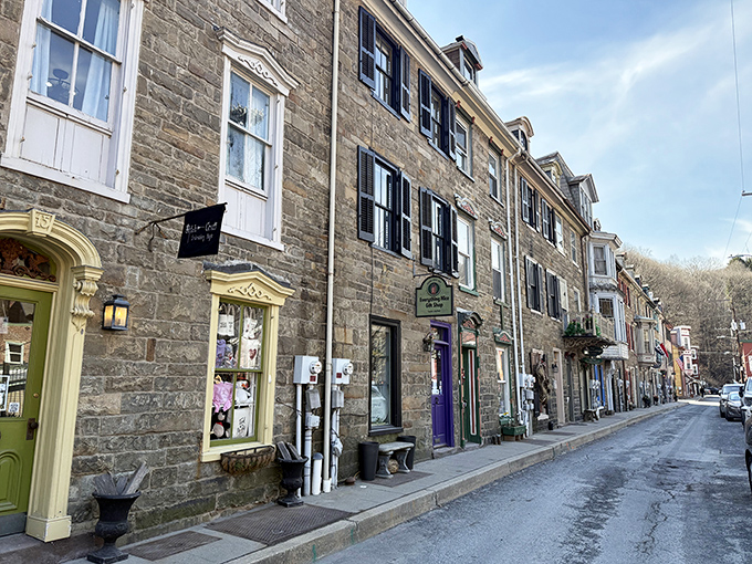 Stone buildings with colorful trim create a streetscape that feels like stepping into a perfectly preserved chapter of American history.