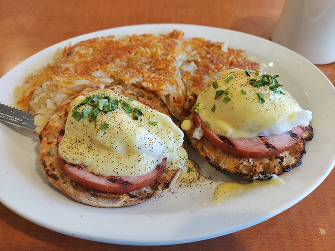Eggs Benedict: where Canadian bacon meets English muffins in an American diner, proving that breakfast diplomacy works deliciously.
