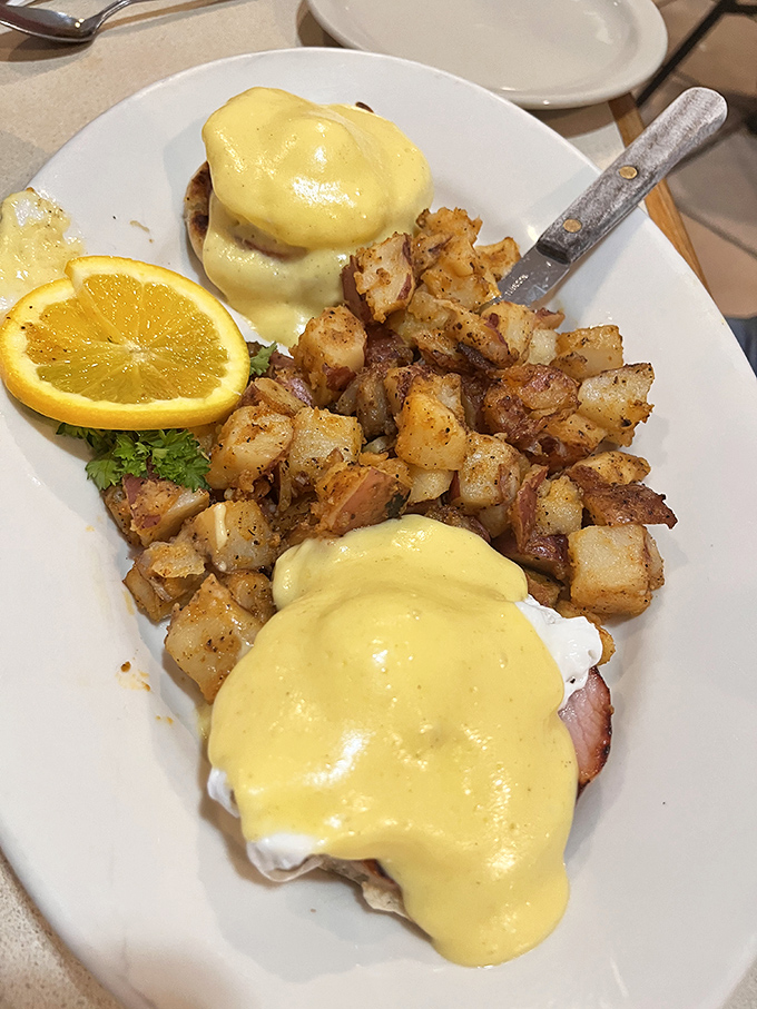 Eggs Benedict: where hollandaise becomes liquid sunshine and breakfast transforms into an occasion. Those potatoes aren't sidekicks&mdash;they're co-stars.