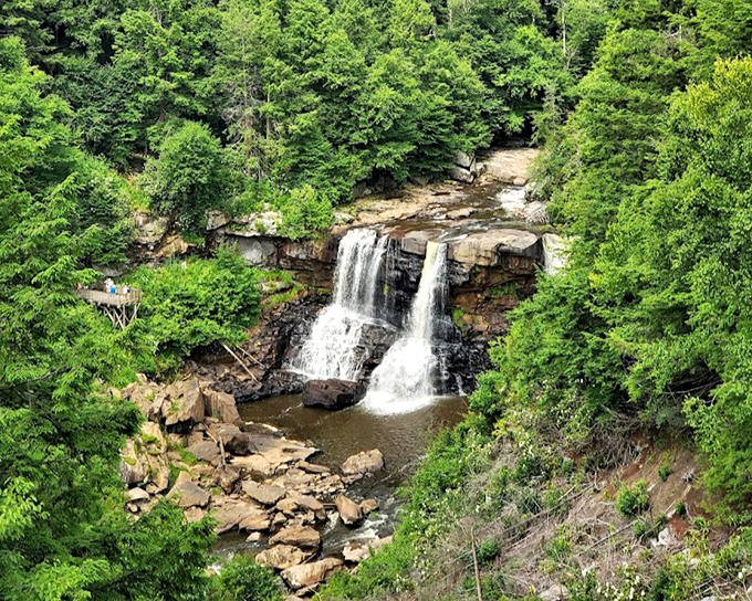 Aerial view reveals the falls' perfect positioning in a lush green embrace. From this vantage point, you can almost hear John Denver humming "Country Roads."