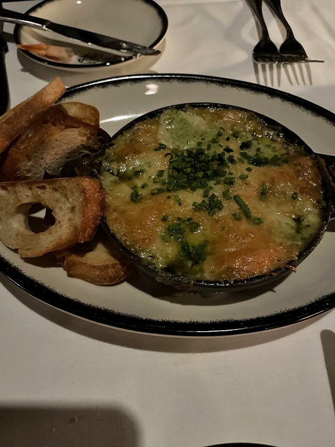 The dish that launched a thousand sighs &ndash; bubbling cheese, rich broth, and bread that's soaked up decades of tradition.