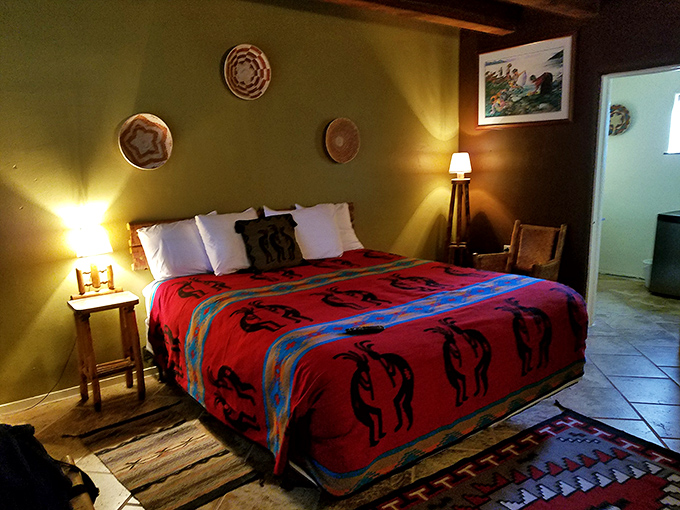 The warm glow of bedside lamps illuminates Native-inspired decor, proving kitsch and comfort can peacefully coexist.
