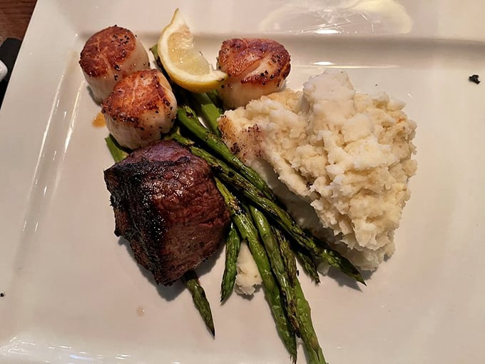 The perfect marriage: tender filet mignon meets buttery potato and grilled asparagus. This plate doesn't need Instagram filters&mdash;it's already the supermodel of steakhouse classics.