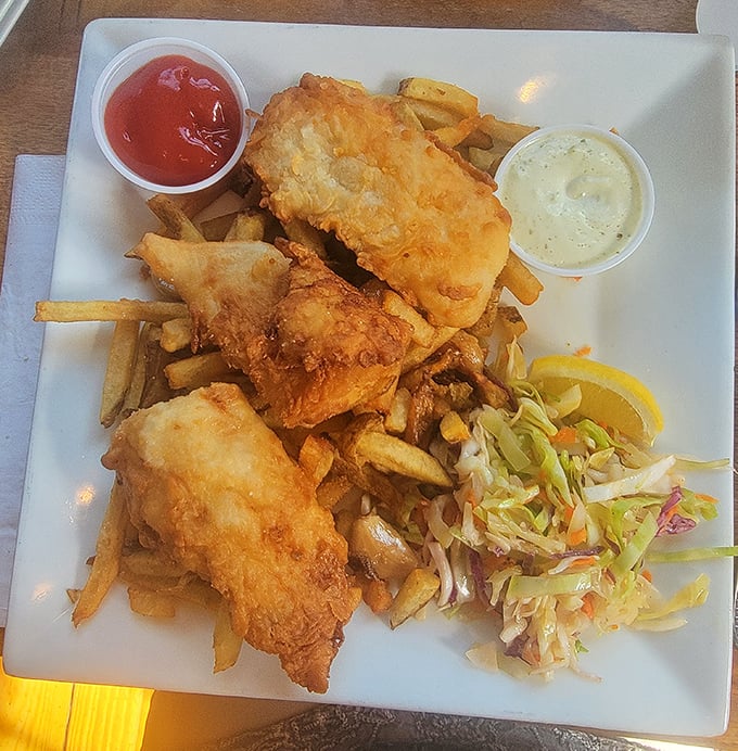 Fish and chips that would make New England proud&mdash;crispy, golden batter protecting flaky white fish, with fries and slaw playing perfect supporting roles.