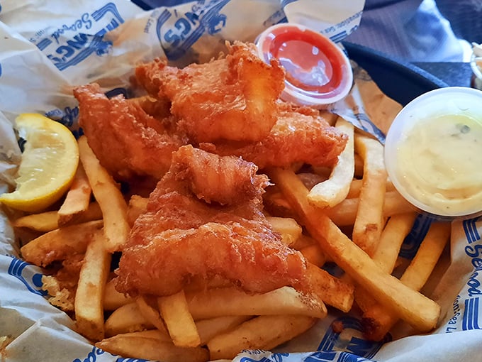 Perfectly fried fish that shatters at first bite, paired with crispy fries and creamy coleslaw. The holy trinity of seafood comfort that never goes out of style.