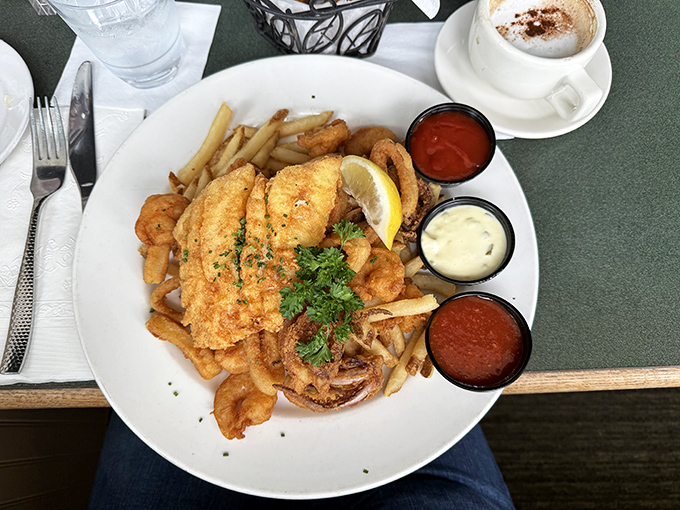The holy trinity of seafood dining: perfectly golden fish, hand-cut fries, and dipping sauces that demand to be explored.