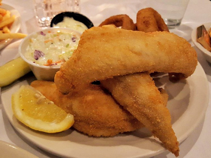 Wisconsin's fish fry tradition at its finest &ndash; crispy, golden perfection with creamy coleslaw that makes Friday feel like a celebration.