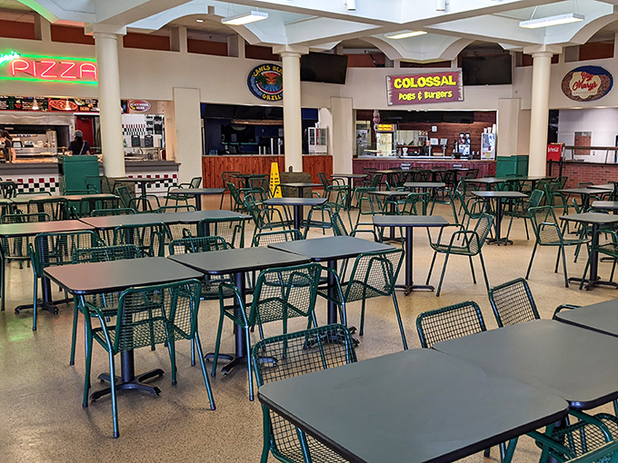 The food court's retro color scheme takes you back to simpler times when shopping marathons required strategic refueling stops.