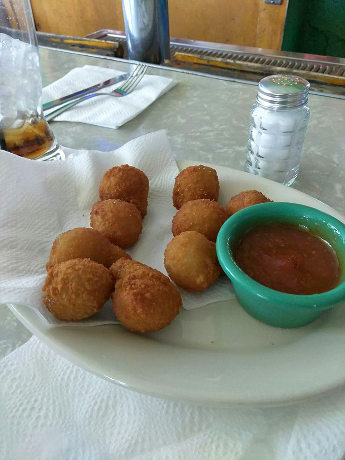Golden-fried mushroom bites that could convert even the most dedicated vegetable skeptic. Dipped in that sauce, they're little umami bombs of joy.