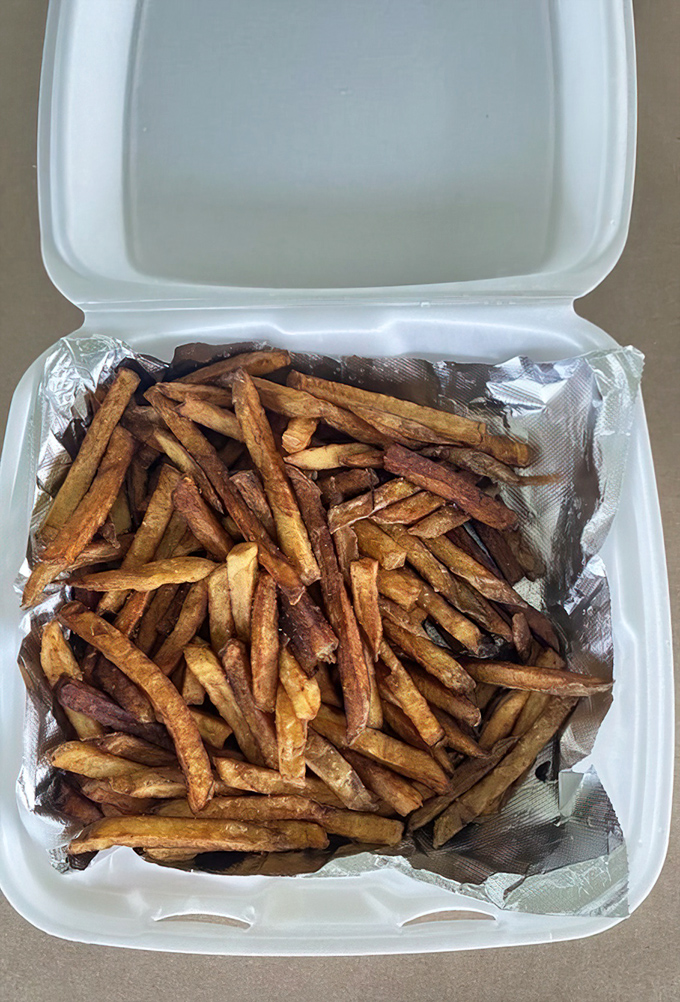 Hand-cut fries with personality&mdash;crispy, irregular, and perfectly imperfect. The kind that make frozen versions weep with inadequacy.