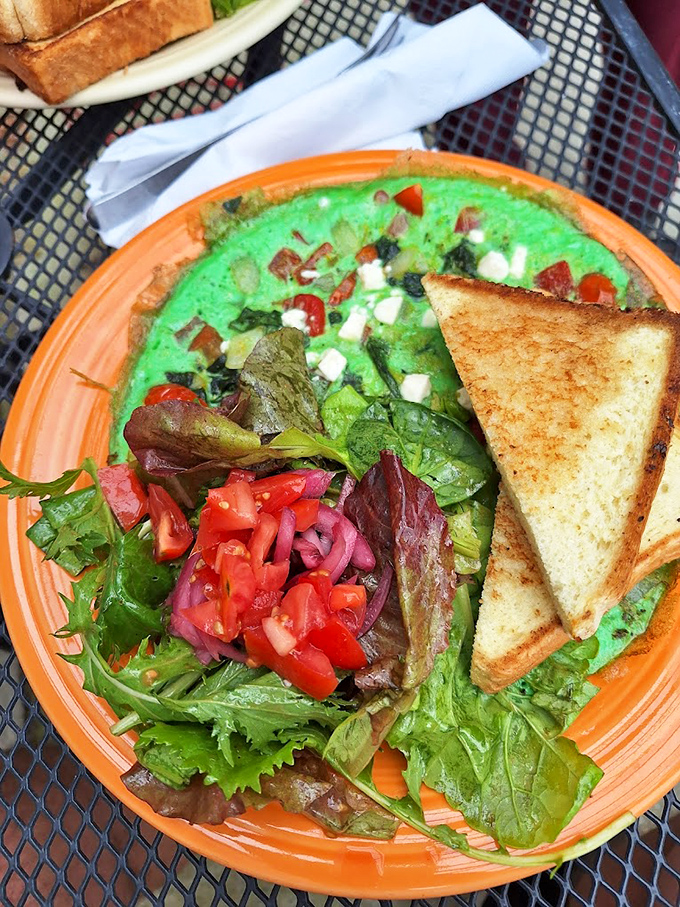 A vibrant green frittata that proves vegetables can party too. The toast is just there as a responsible chaperone.
