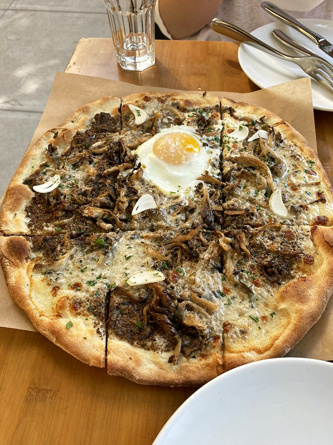 The funghi pizza&mdash;where mushrooms throw the party of the year and a farm egg gets the VIP treatment in the center.