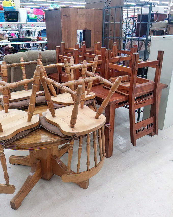The furniture section resembles a wooden chair convention where every seat has a story and every table has hosted countless meals.