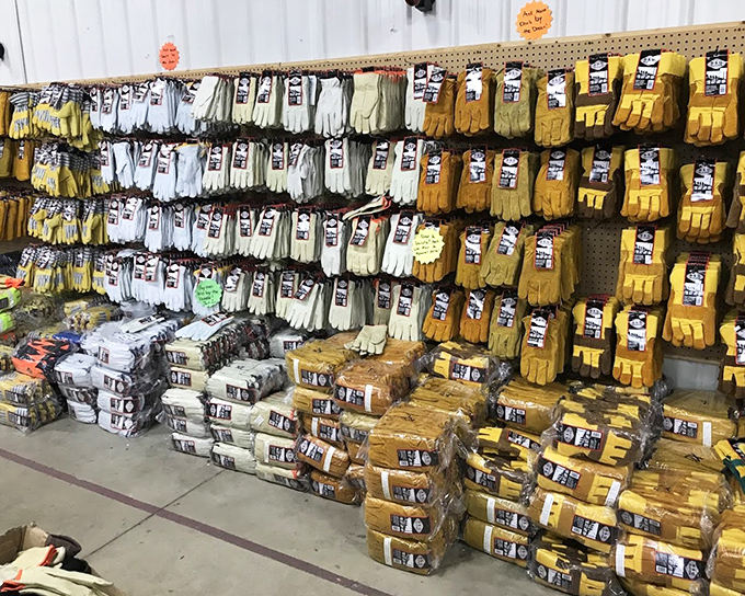 Work gloves stacked like golden treasures, because protecting your hands shouldn't require a second mortgage on the house. 