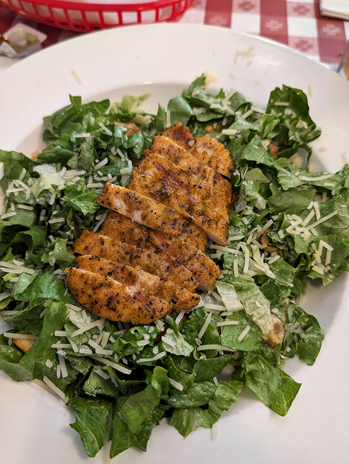 A grilled chicken salad that proves healthy eating doesn't have to be punishment—those grill marks tell the whole delicious story.