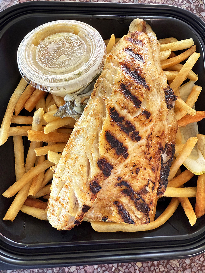 Those perfect grill marks on this fish fillet are like racing stripes for your taste buds.
