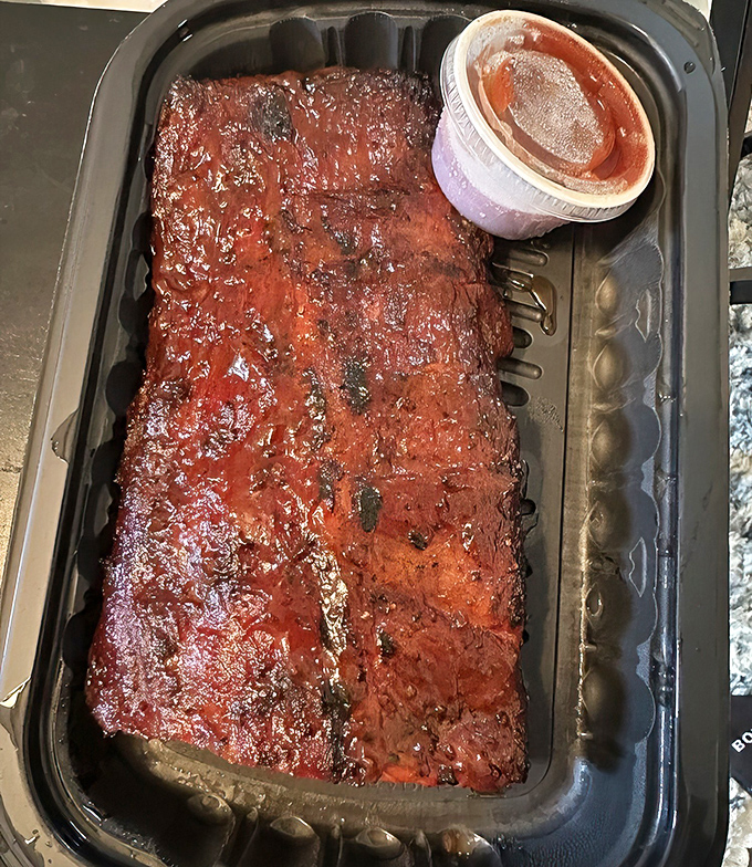 These ribs don't just fall off the bone &ndash; they practically leap into your mouth, glazed with a sauce that balances sweet, tangy, and smoky notes.