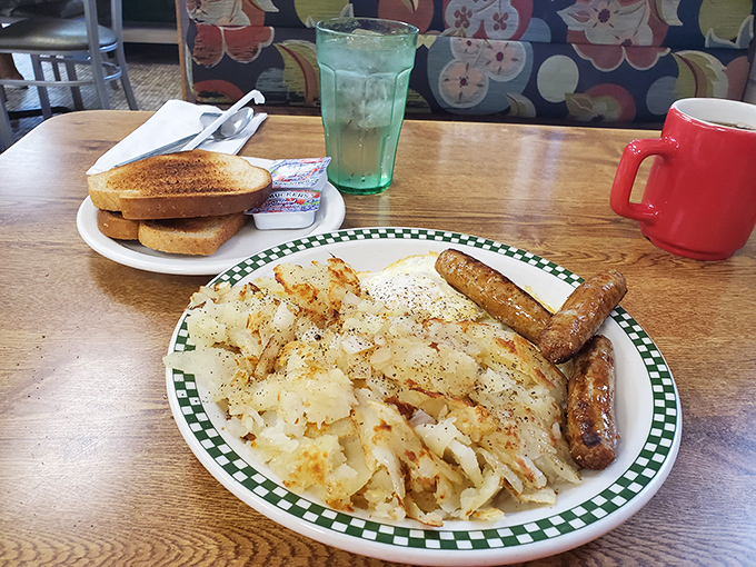 Home fries that achieve that mythical balance&mdash;crispy edges, tender centers&mdash;paired with sausage links that snap with each bite. Breakfast perfection exists.