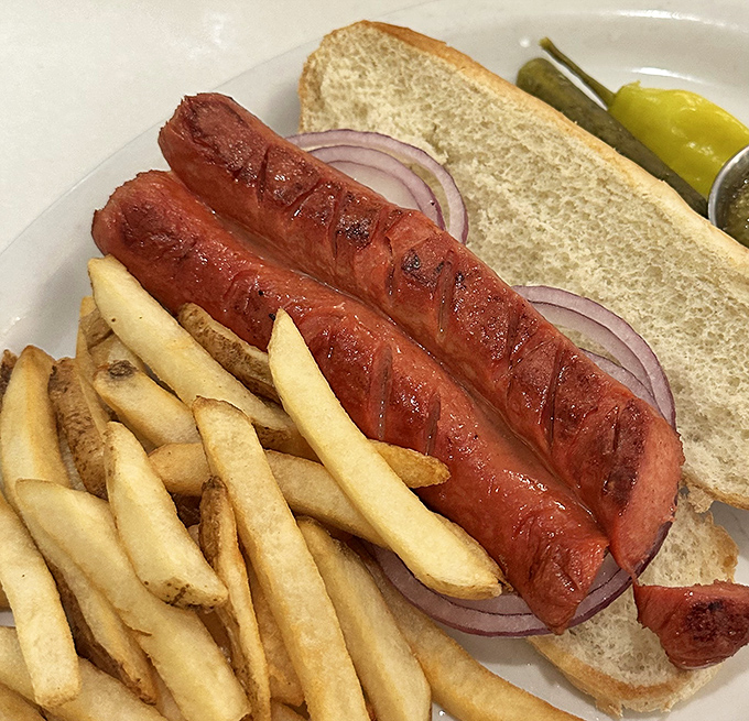 Hot dogs grilled to snap-perfect perfection, proving that sometimes the simplest pleasures are the ones that have stood the test of time.