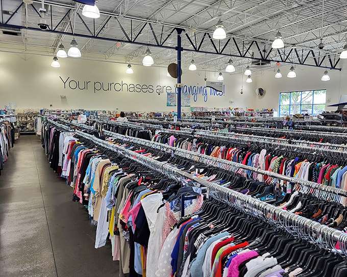 "Your purchases are changing lives!" proclaims the wall, reminding bargain hunters that retail therapy here doubles as community support.