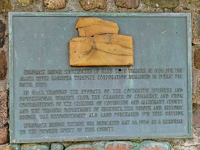 This weathered plaque reveals the bridge's origin story&mdash;like finding Batman's birth certificate tucked away in the Allegheny Mountains.