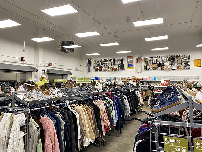 The clothing section stretches toward the horizon like a textile sea, each garment a tiny island of possibility in the thrift store archipelago.