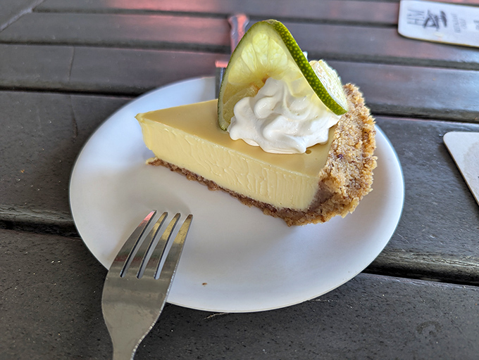 Key lime pie that strikes the perfect balance between sweet and tart – like Florida sunshine with just enough attitude. That nut crust adds the plot twist.