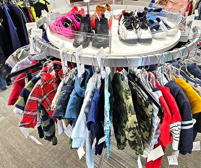 A circular display of childhood possibilities. These tiny garments represent both outgrown memories and future adventures, all priced to accommodate growth spurts and playground mishaps.