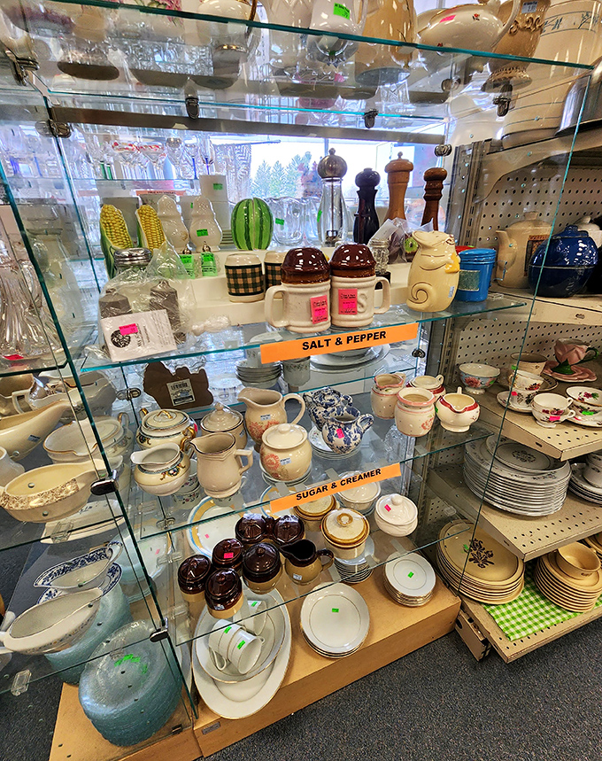 A glass case of culinary nostalgia. Those salt and pepper shakers probably witnessed countless "please pass the potatoes" at family dinners.