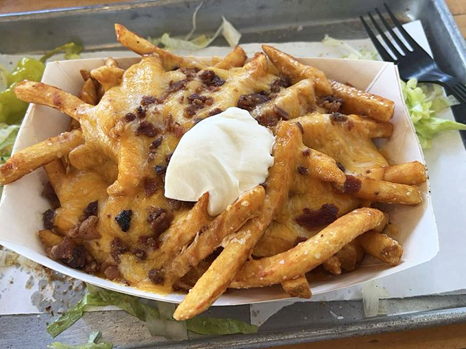Loaded fries that don't mess around&mdash;crispy potatoes smothered in melted cheese and bacon with a dollop of sour cream for good measure.