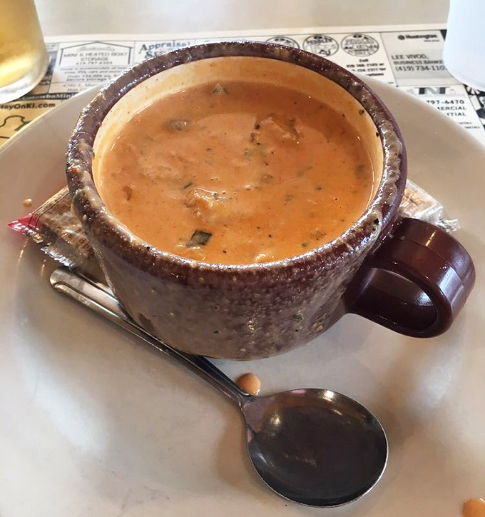 The lobster chowder arrives in a rustic ceramic mug &ndash; creamy, hearty, and packed with enough seafood to make you temporarily forget you're in Ohio.