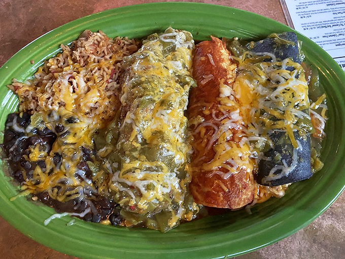 The "Christmas style" enchilada platter&mdash;where red and green chile sauce coexist in peaceful, delicious harmony. New Mexico's gift to your taste buds.